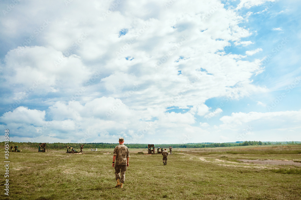 Military soldiers during military exercises on the field. Soldier ...