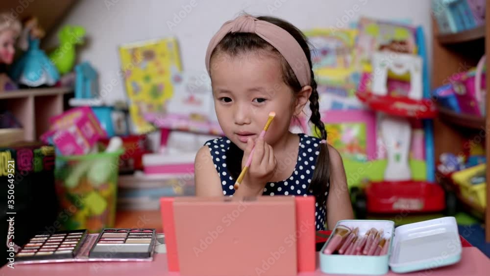 Child make up,Asian little girl is applying eyeshadow make up and ...