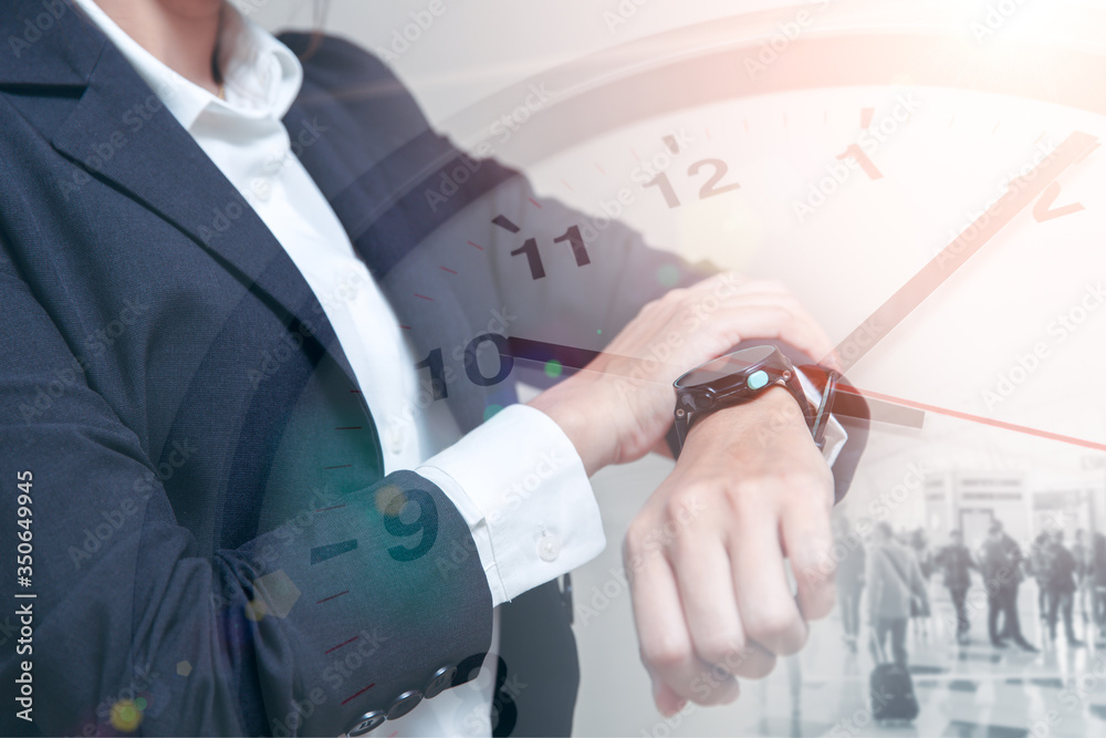 Business times, People looking at wristwatch overlay with time clock ...