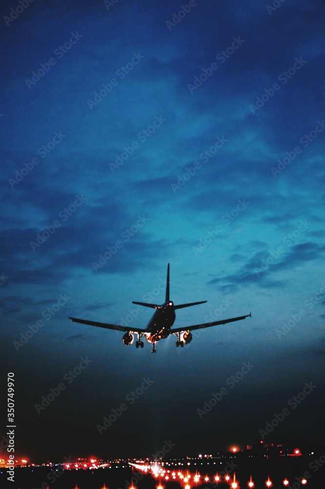 Airplane In The Sky At Night