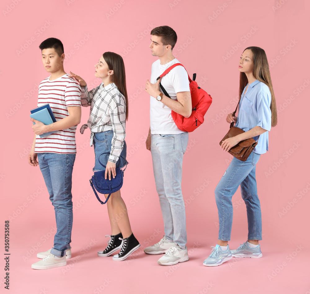 Students waiting in line on color background Stock Photo | Adobe Stock