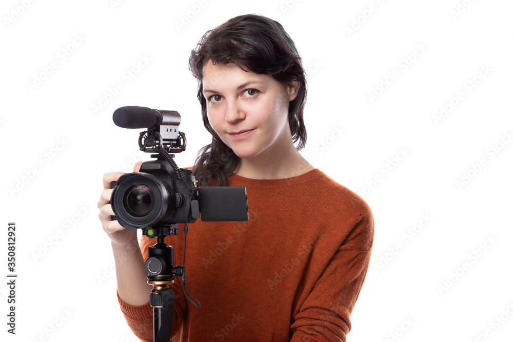 Female art student studying to be a filmmaker using a camera on a ...