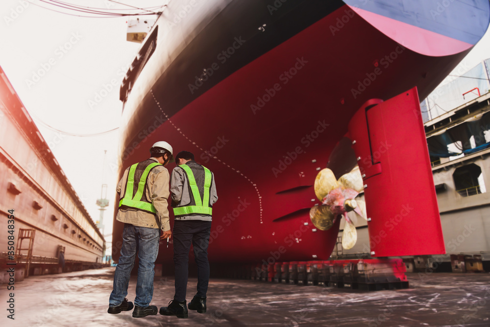 worker check condition At Stern ship Propeller under Reconstruction ...