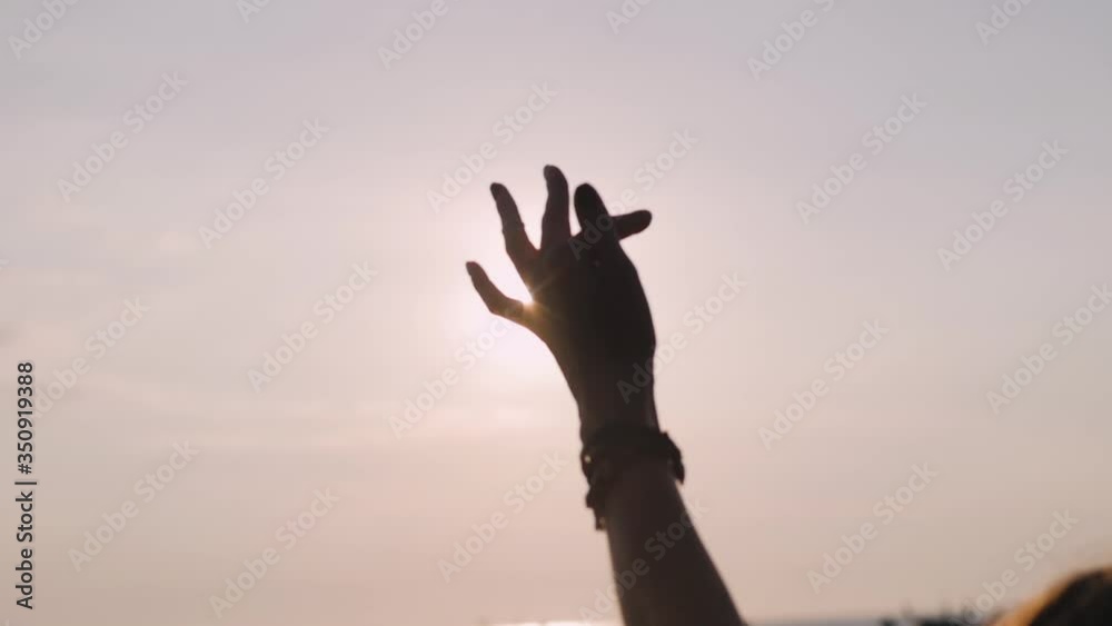 Sun Throught Hand.Woman Looks At The Sun Through Hand.Grasping Sun With ...