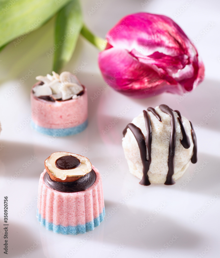 Chocolate candies without sugar on the white background. Raw vegan ...