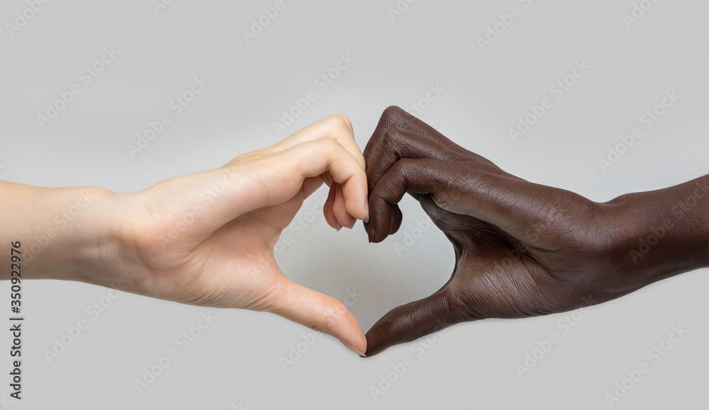 Black and white heart-shaped hands on a grey isolated background. The ...