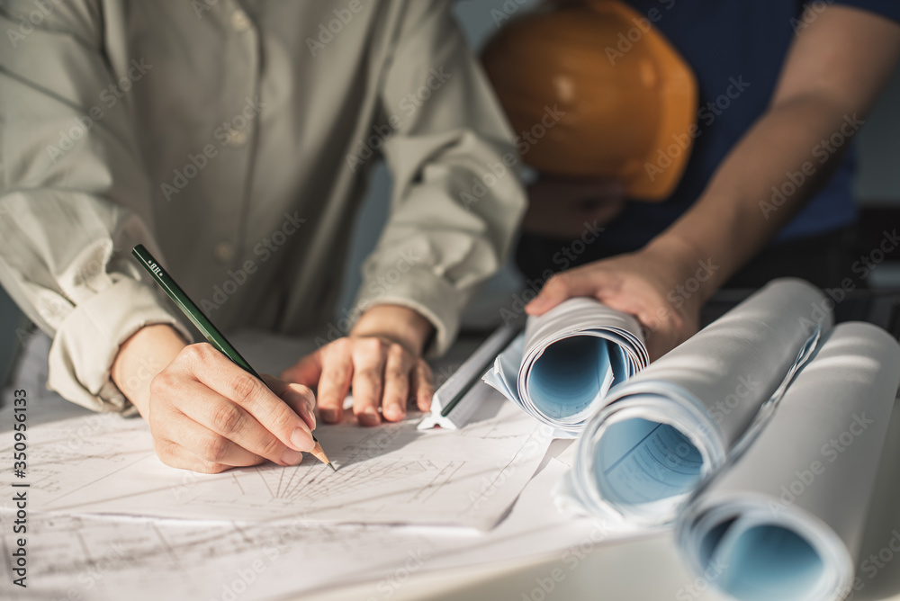 Architect working on blueprint. Architects workplace - architectural ...