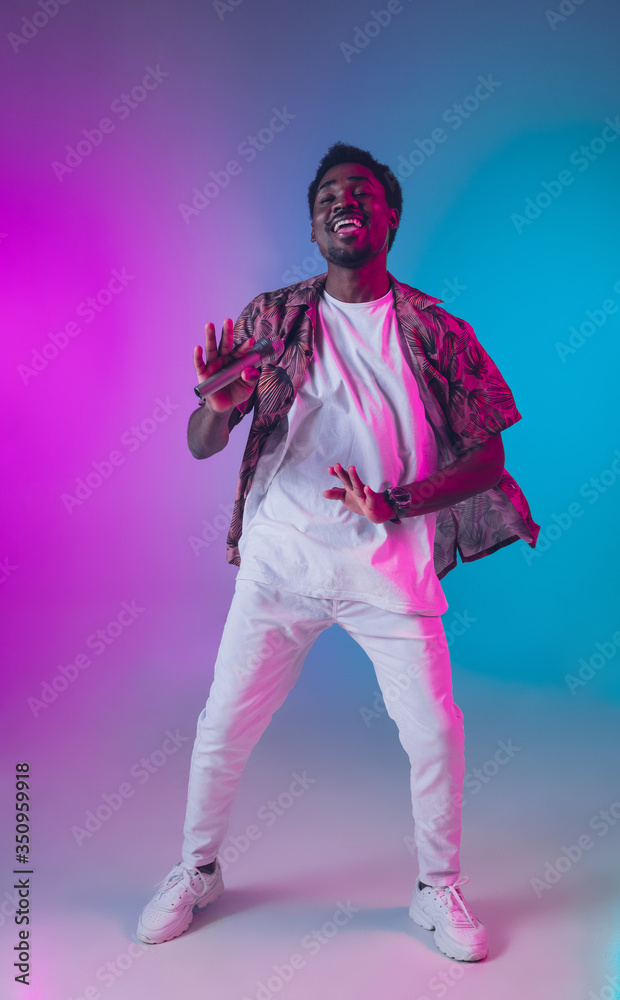 African-american male singer portrait isolated on gradient studio ...