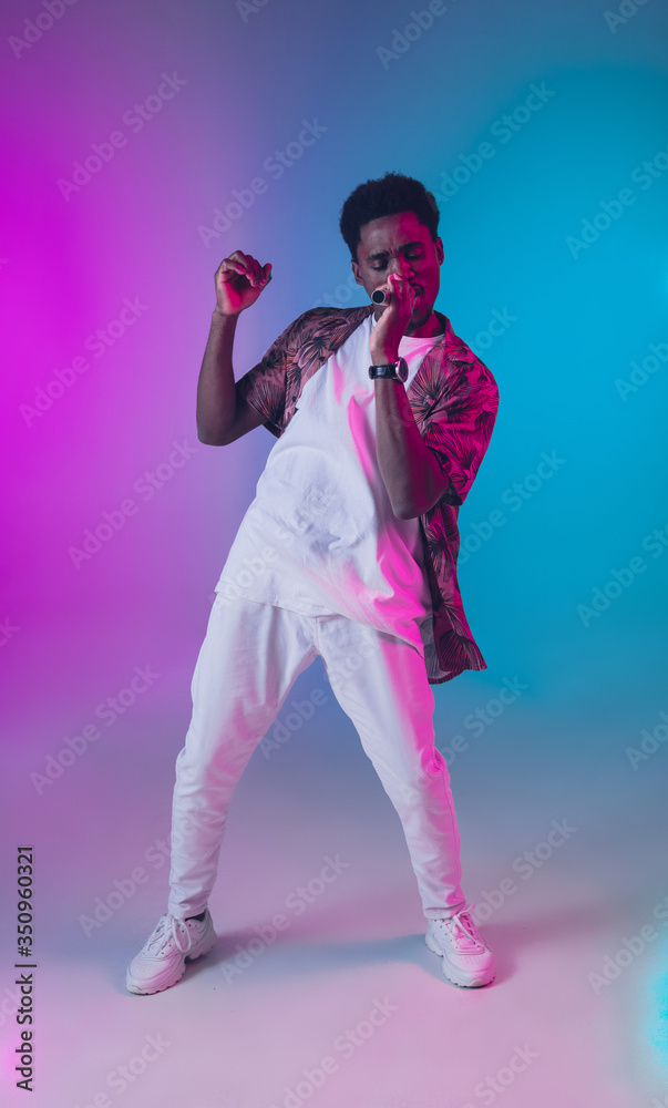 African-american male singer portrait isolated on gradient studio ...