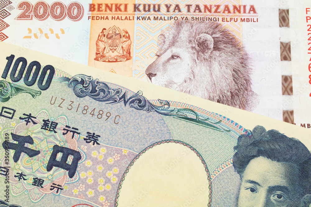 A macro image of a Japanese thousand yen note paired up with a orange ...