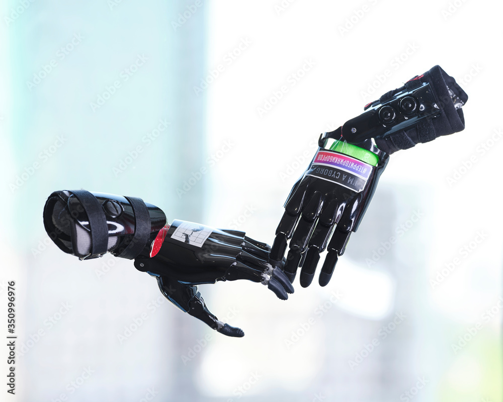 two prosthetic arms floating in the air Stock Photo | Adobe Stock