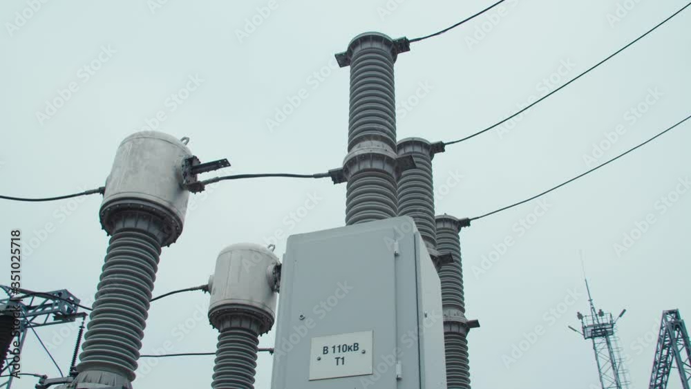 High voltage substation 110 kV with tall pylons and hog voltage ...