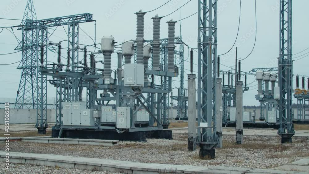 High voltage substation 110 kV with tall pylons and hog voltage ...