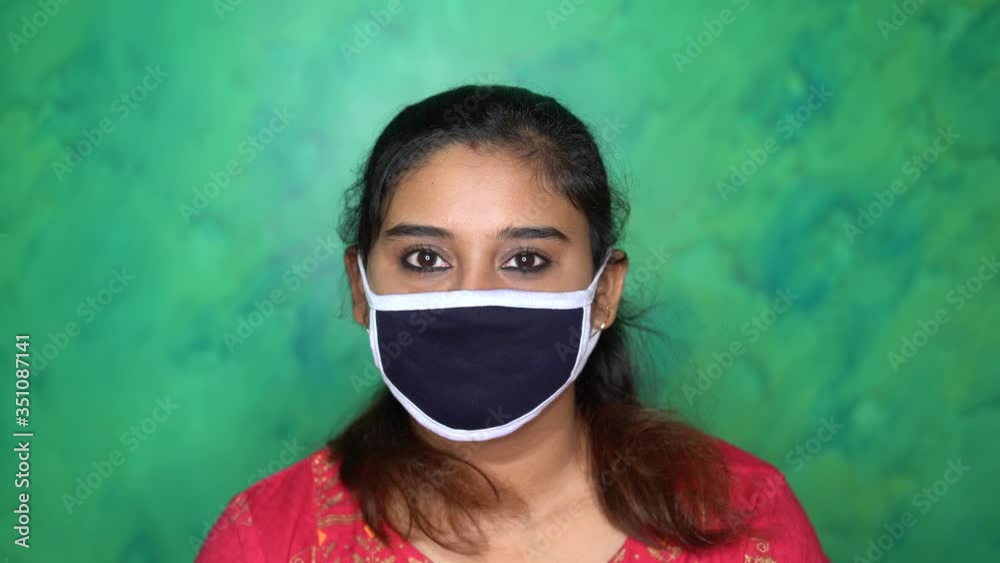 Portrait of Asian Indian girl wearing protective mask for prevention of ...