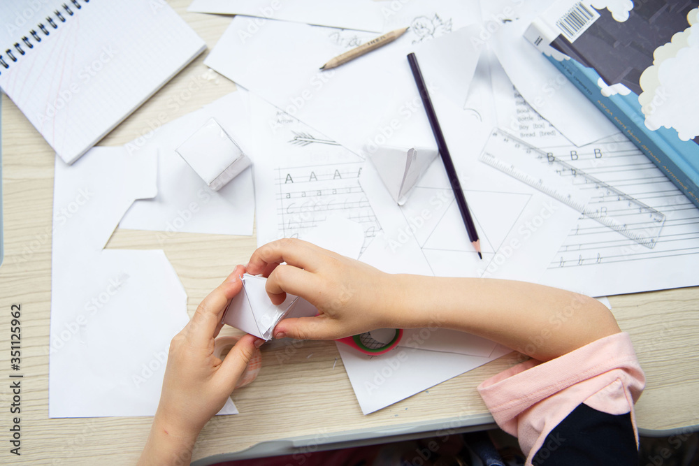 Child making geometric shapes. Home education. Back to school ...