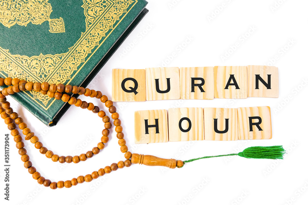 Word QURAN HOUR written on wooden cubes.Flat lay composition with ...