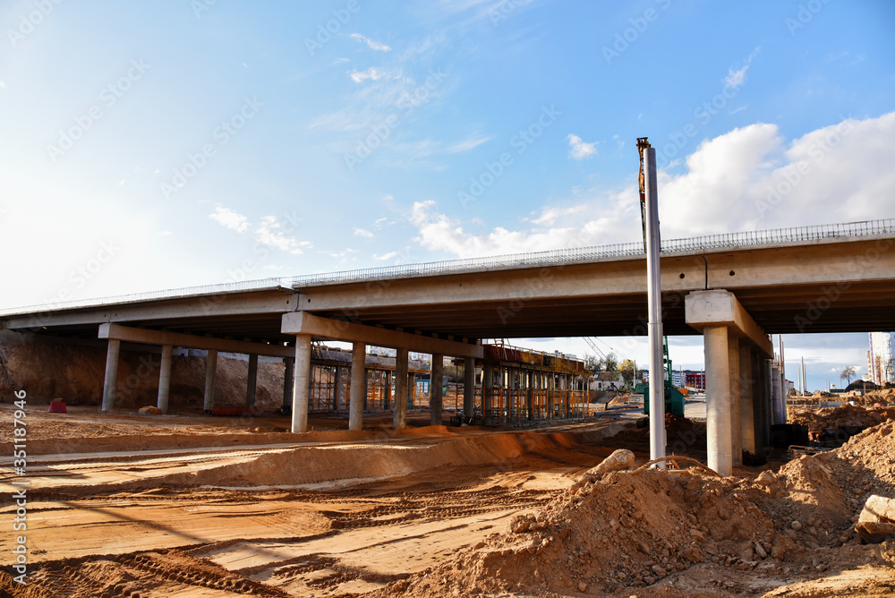 Roundabout and traffic bridge construction. Construction highway ramps ...