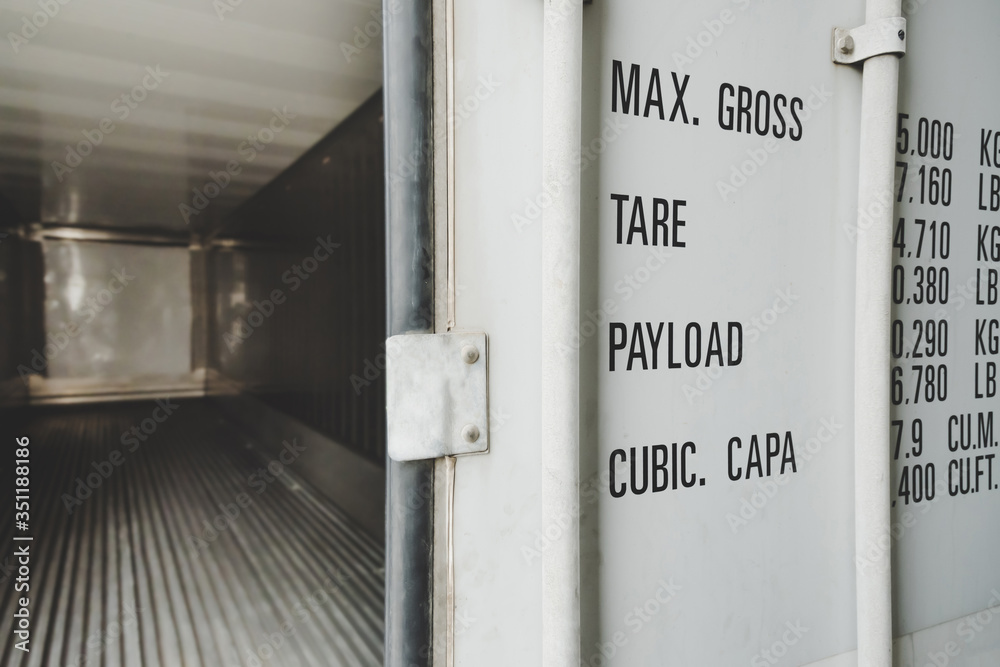 detail of white open door empty shipping cargo container for ...