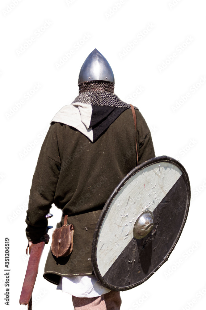 Medieval warrior in a pointed helmet chain mail with a round shield in ...