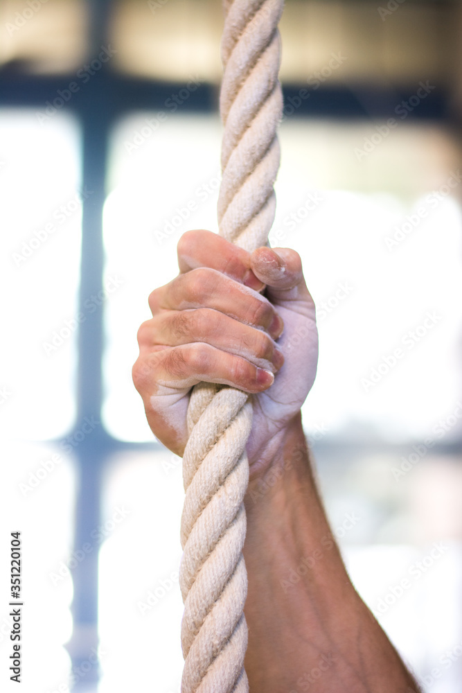 acrobatic gymnast hand in a olympic rope to climb. Stock Photo | Adobe ...