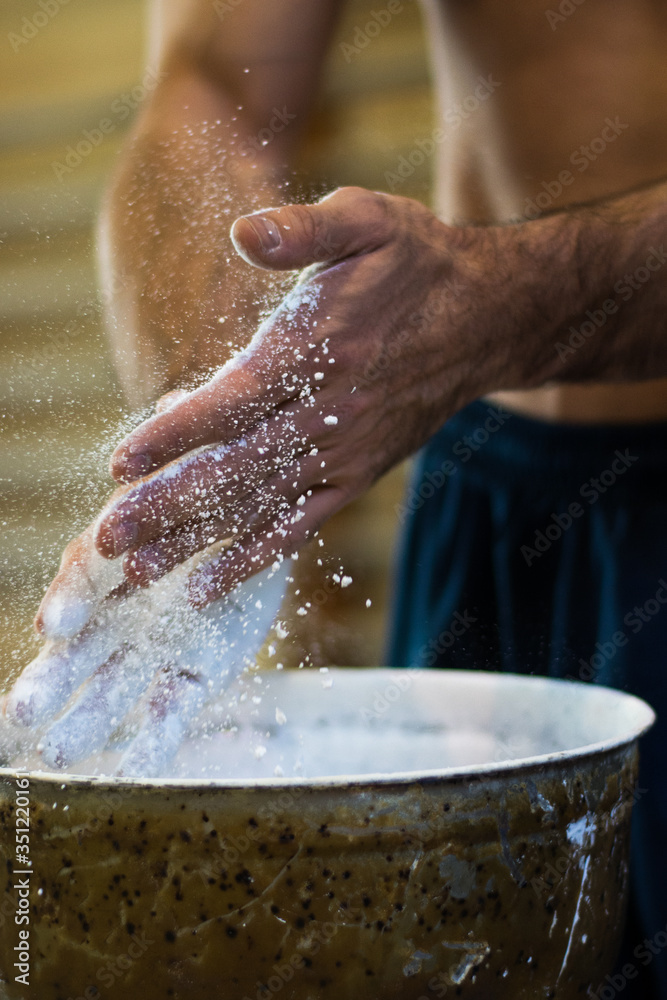 acrobatic gymnast preparing his hands with magnesium Stock Photo ...