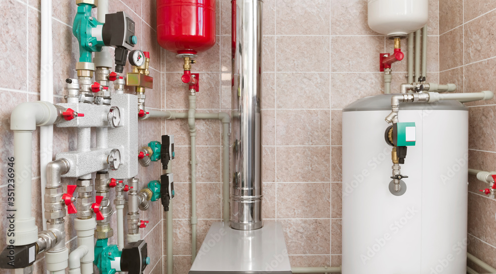 House boiler room interior with modern water heating system Stock Photo ...