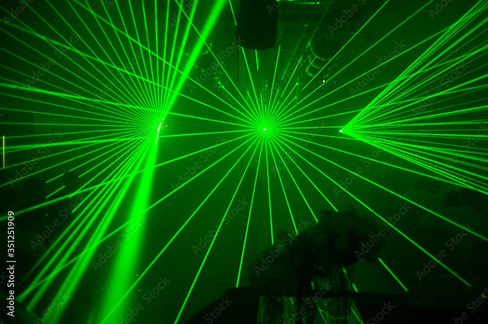 laser beam lights at a party with various colors Stock Photo | Adobe Stock