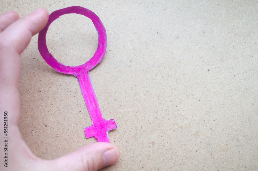 Hand holds the symbol of Venus. The symbol of a woman. Women's Health ...