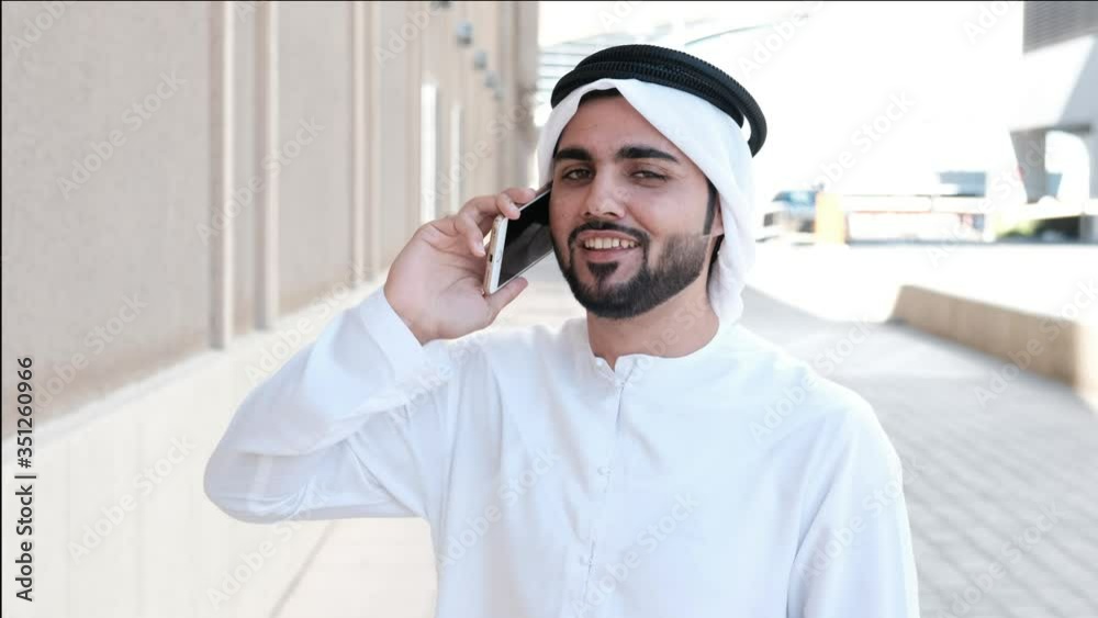Emirati Arab business man on phone. Calling Middle Eastern Arabic guy ...