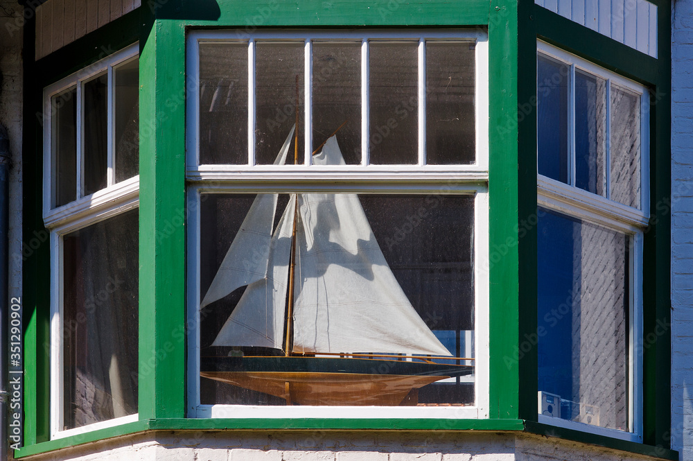 old wooden window with a yacht model in Ostend Stock Photo | Adobe Stock