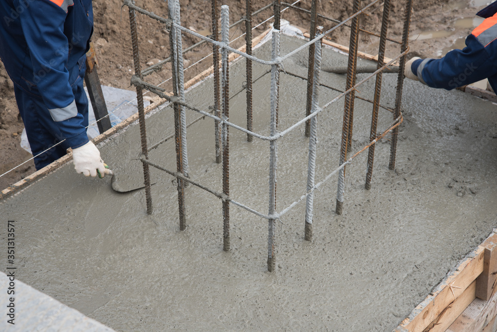 The process of compacting and smoothing fresh concrete. Concrete is ...