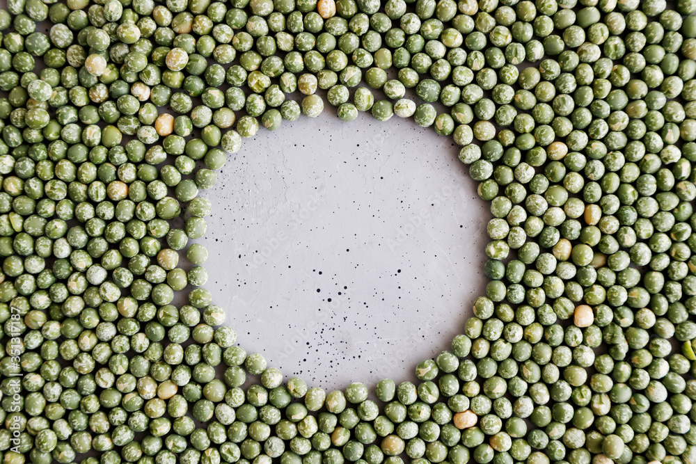 Background or texture of green dry peas with a round place for text in ...