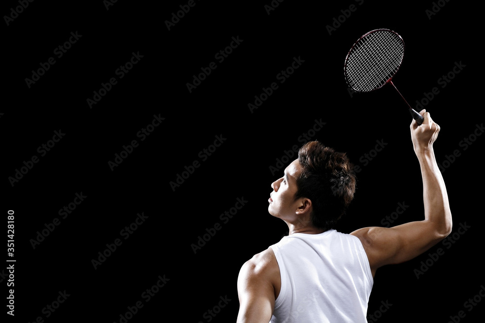Man playing badminton Stock Photo | Adobe Stock