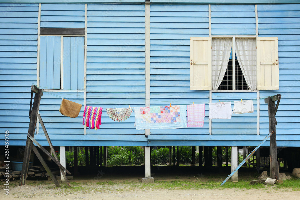 Clothes hanging on clothesline Stock Photo | Adobe Stock
