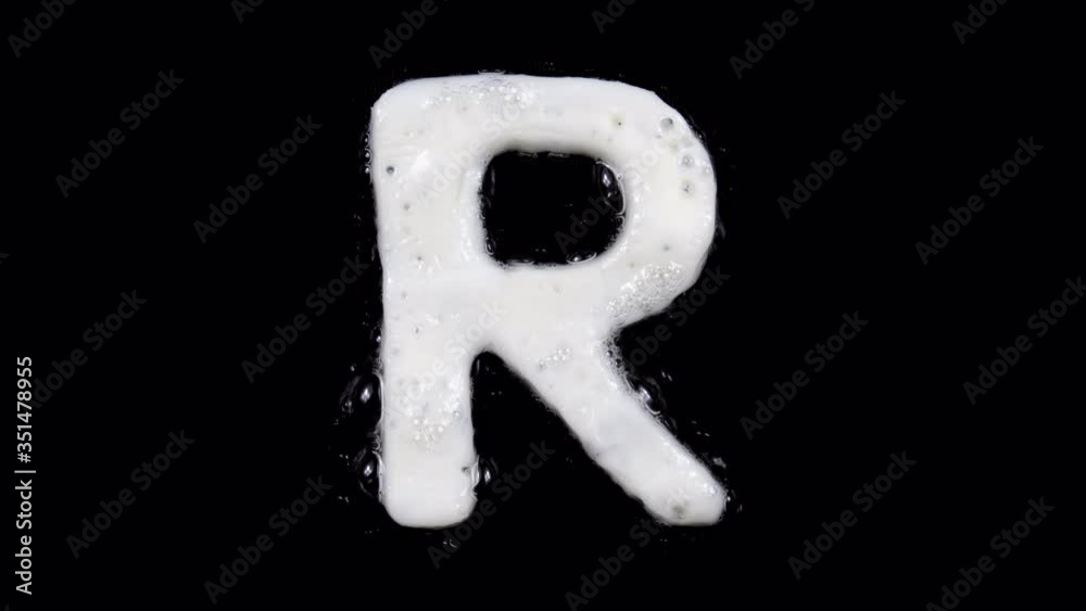 Egg white frying letter R, top view, include two looped 10 seconds ...