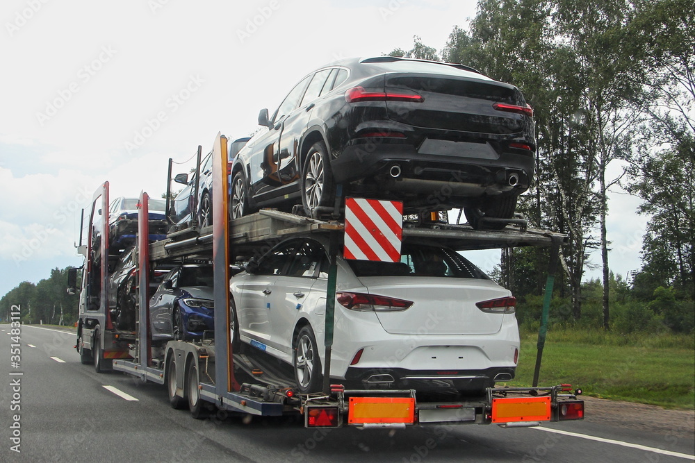 Loaded two level car carrier truck with two-axle car transporter semi ...