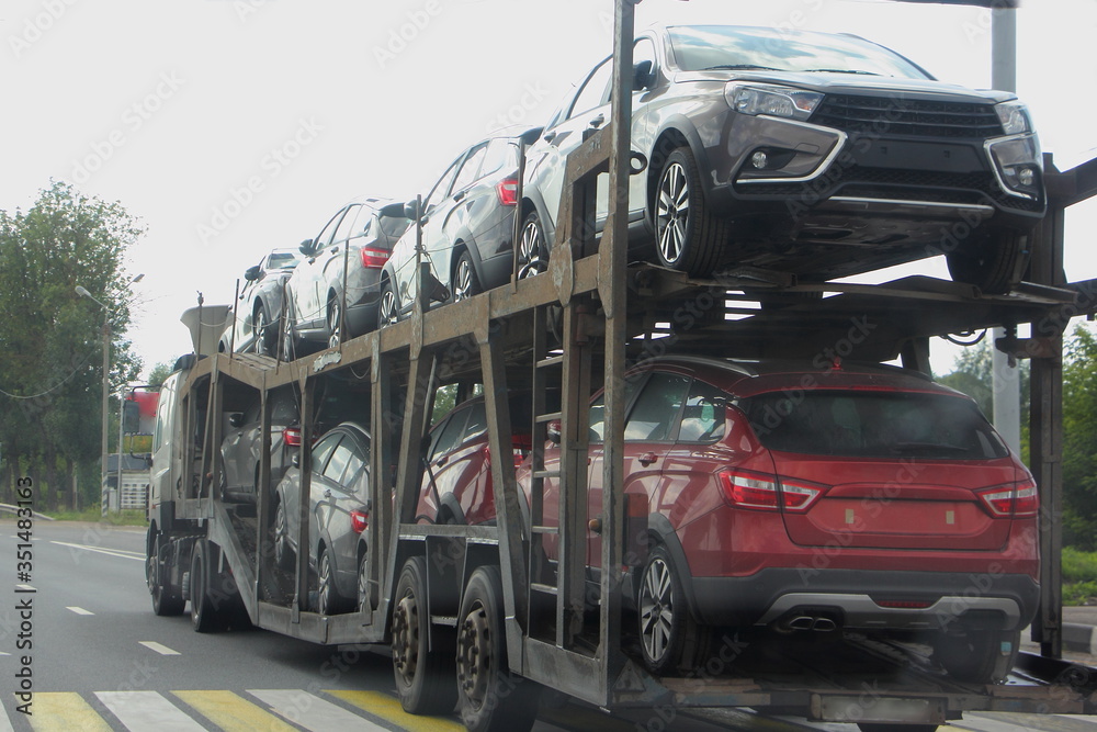 Loaded two-level car carrier truck with two-axle car transporter semi ...