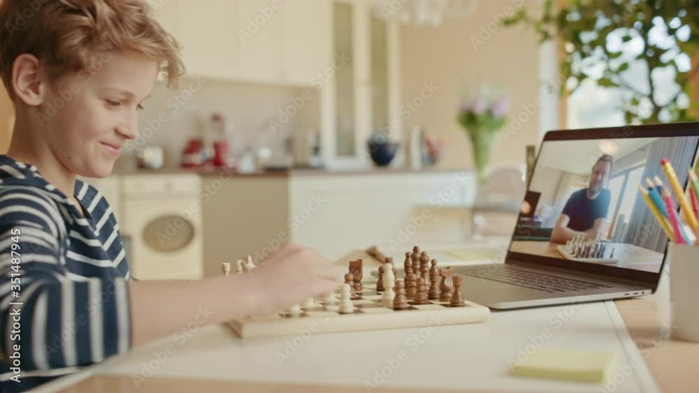 Stockvideo Brilliant Little Boy Playing Chess with His Chess Master ...
