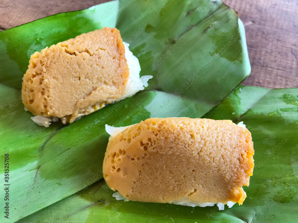 'Khao Niao Sangkhaya' Thai dessert sticky rice with egg custard wrapped ...