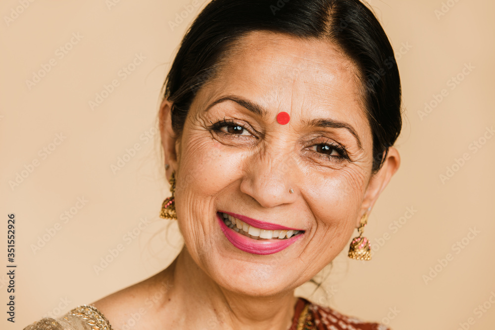 Happy Indian woman wearing a bindi Stock Photo | Adobe Stock