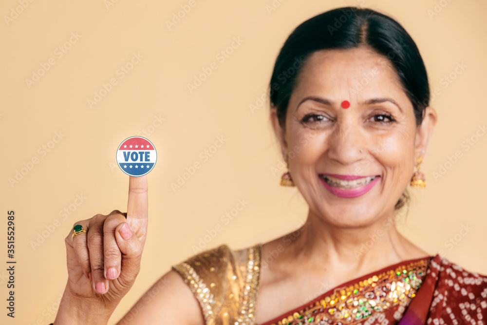 Indian woman showing a vote sticker Stock Photo | Adobe Stock