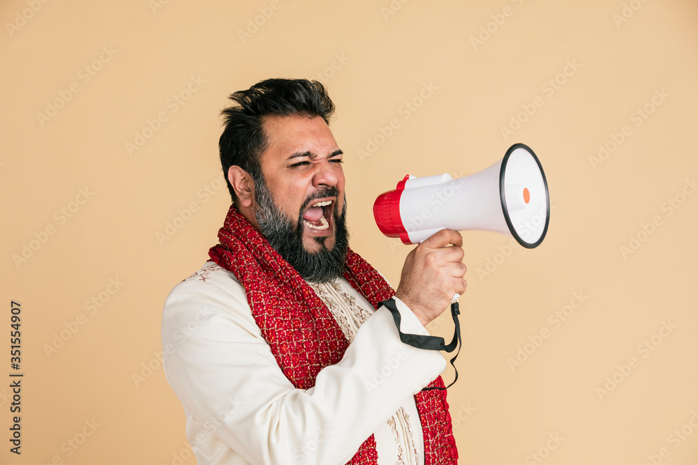 Indian man screaming into a megaphone Stock Photo | Adobe Stock