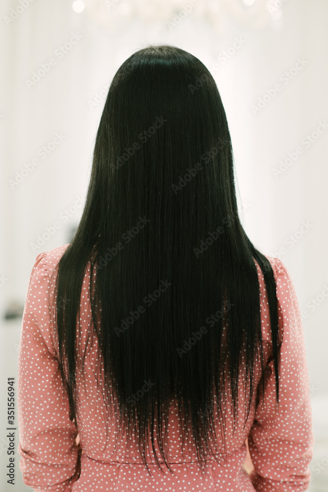 Beautiful long brunette hair, back view. Before and after performing ...