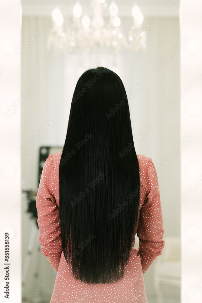 Beautiful long brunette hair, back view. Before and after performing ...