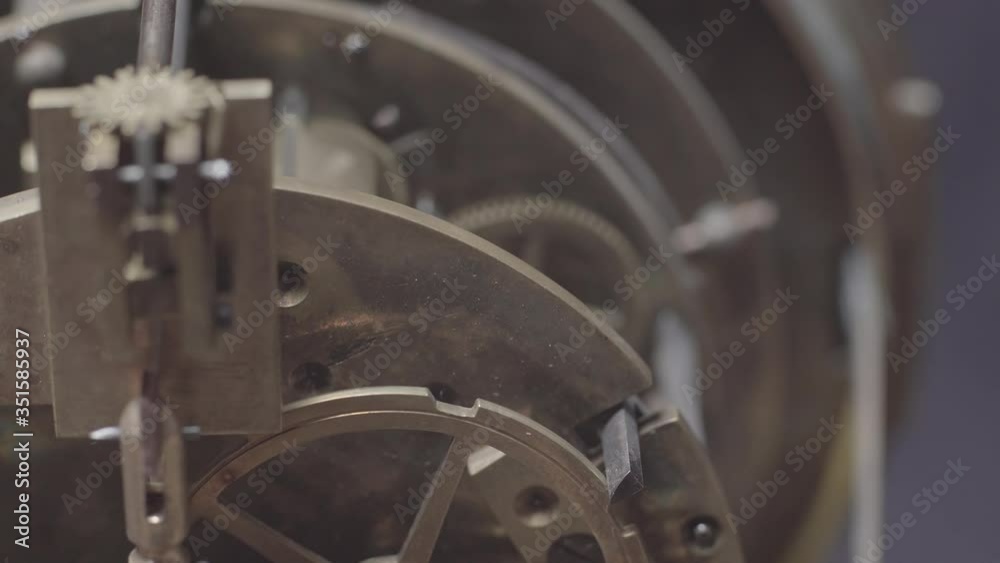 An inside view macro shot of an antique vintage clock with a detailed ...