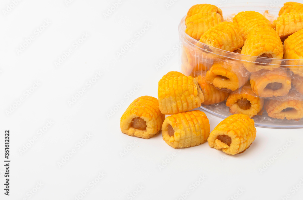 Pineapple roll tart cookies known as Tat Nenas isolated on white ...
