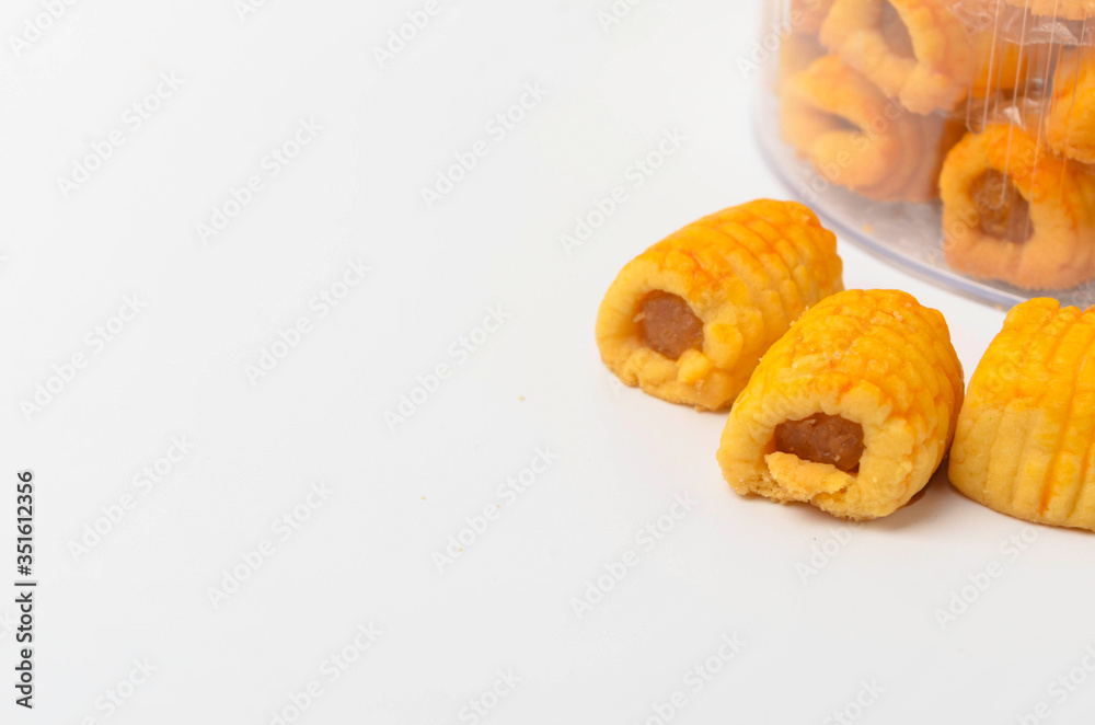 Pineapple roll tart cookies known as Tat Nenas isolated on white ...