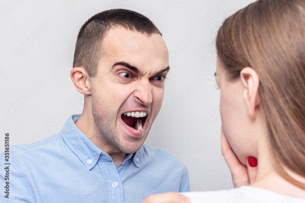 Angry husband yells at his wife, a married couple arguing, concept of ...