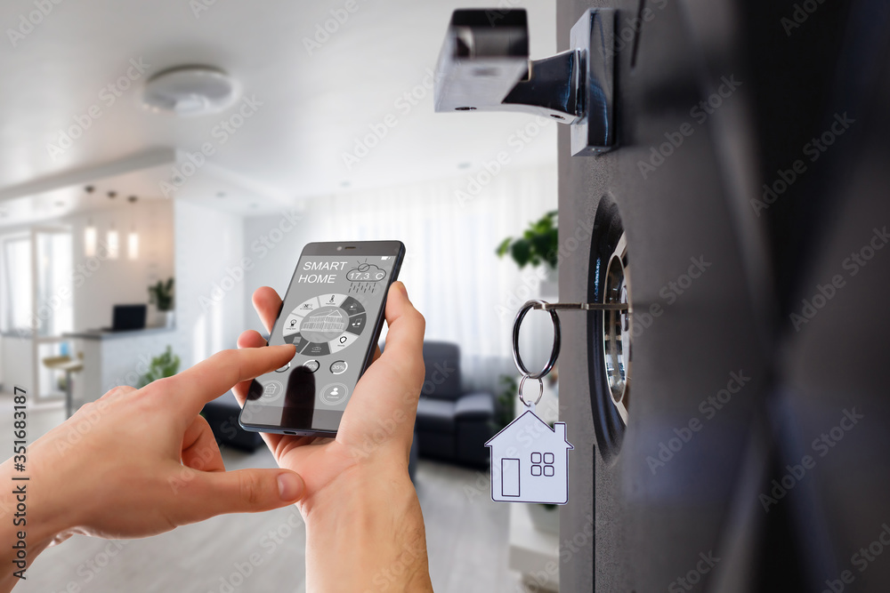 smart house, home automation, device with app icons. Man uses his ...