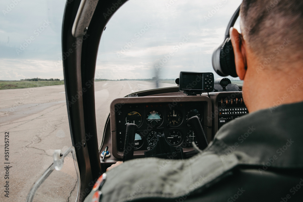 Pilot in cockpit. Aircraft Pilot at work. Rear view of pilots. Rear ...